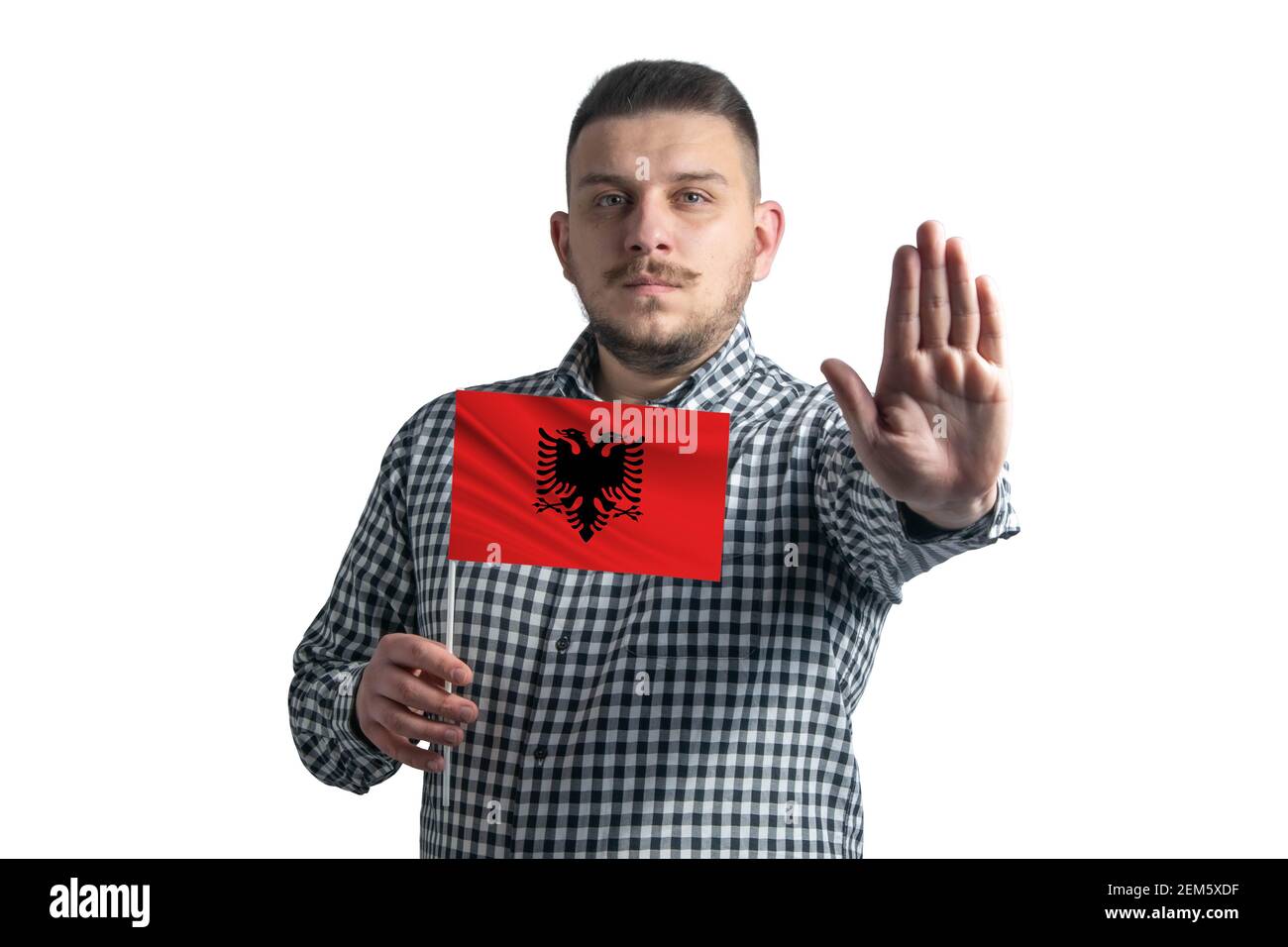 White guy holding a flag of Albania and with a serious face shows a ...
