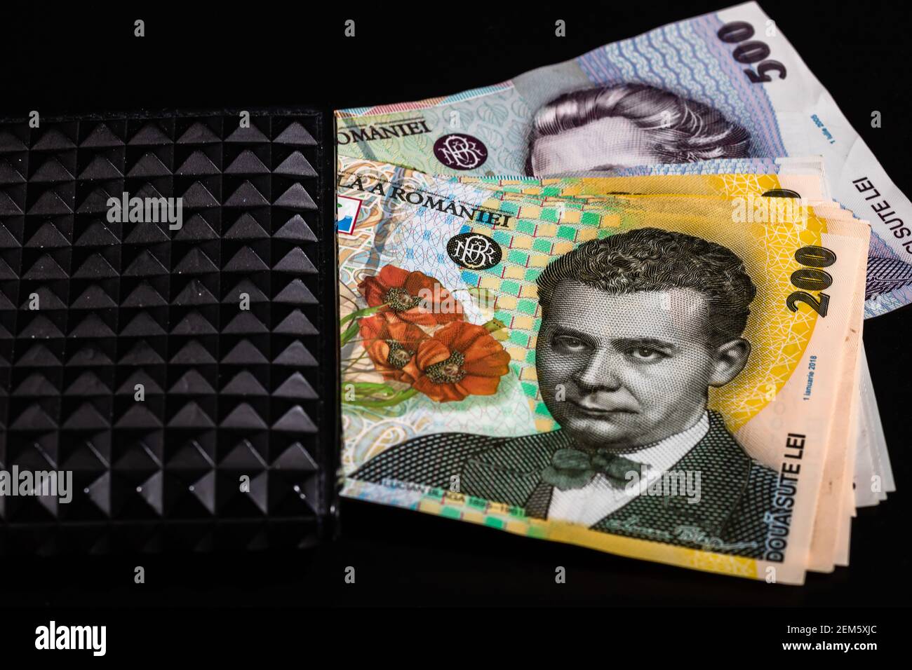 LEI romanian money banknotes in black wallet isolated Stock Photo - Alamy