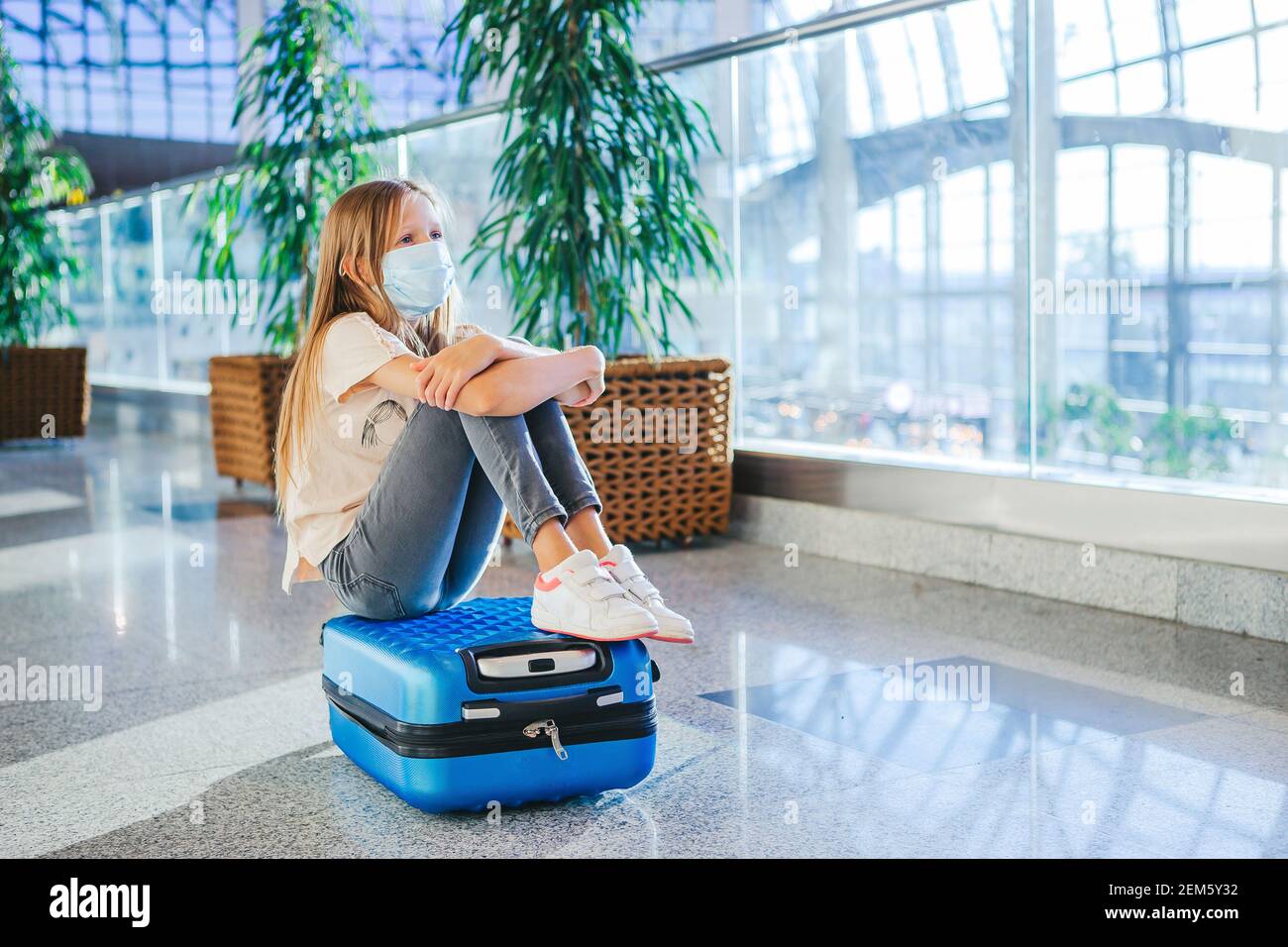Little kid in medical mask in airport waiting for boarding Stock Photo ...
