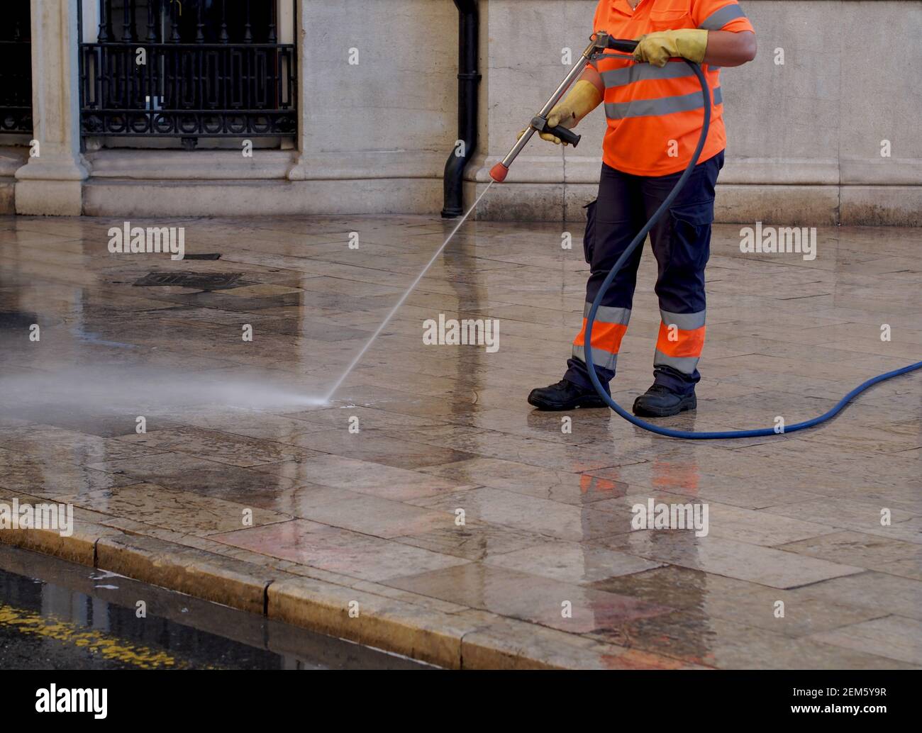 City workers - cleaning and washing of city streets Stock Photo - Alamy