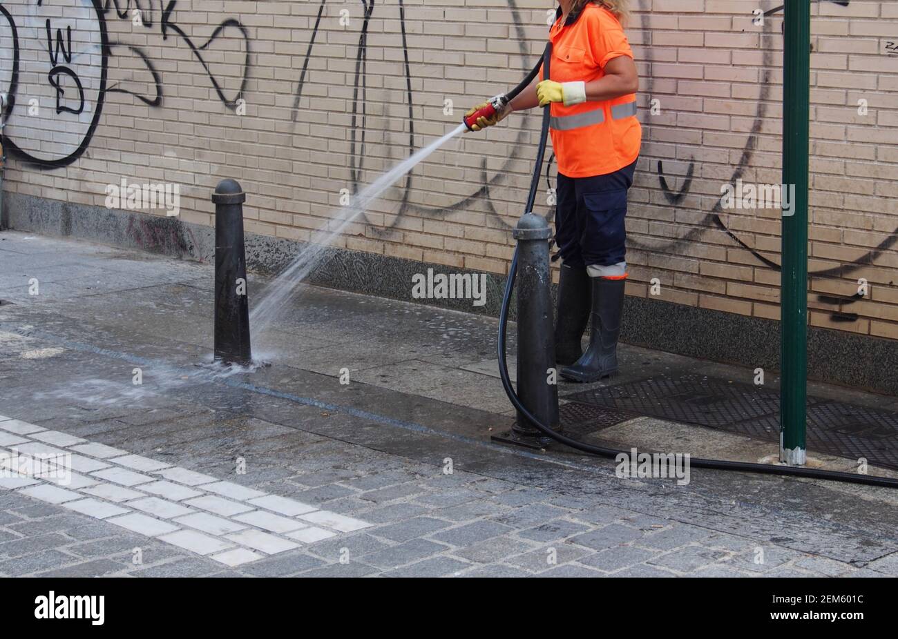 City workers - cleaning and washing of city streets Stock Photo - Alamy