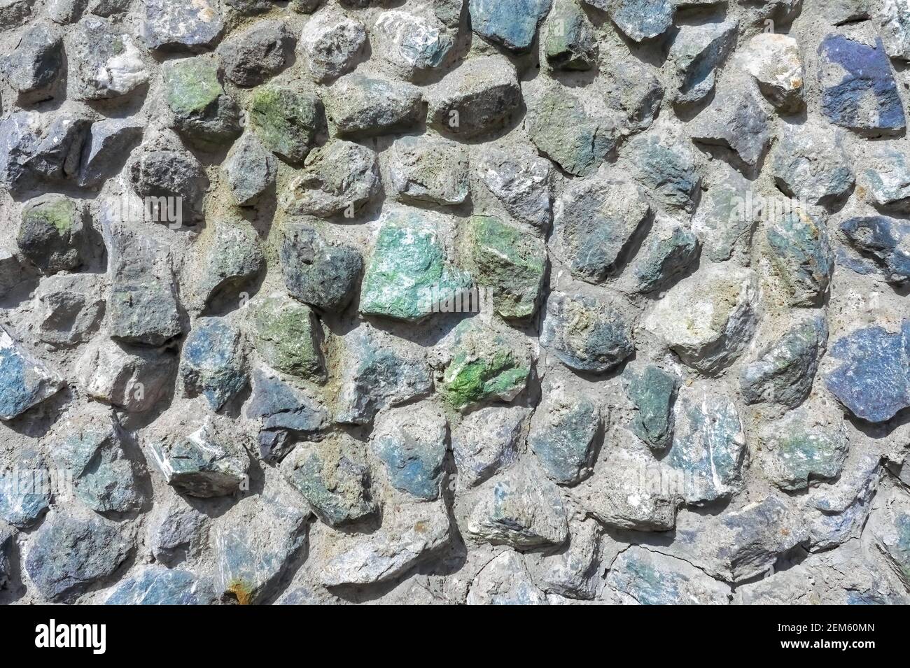 Fragment of the wall. Texture of concrete wall with granite rubble ...