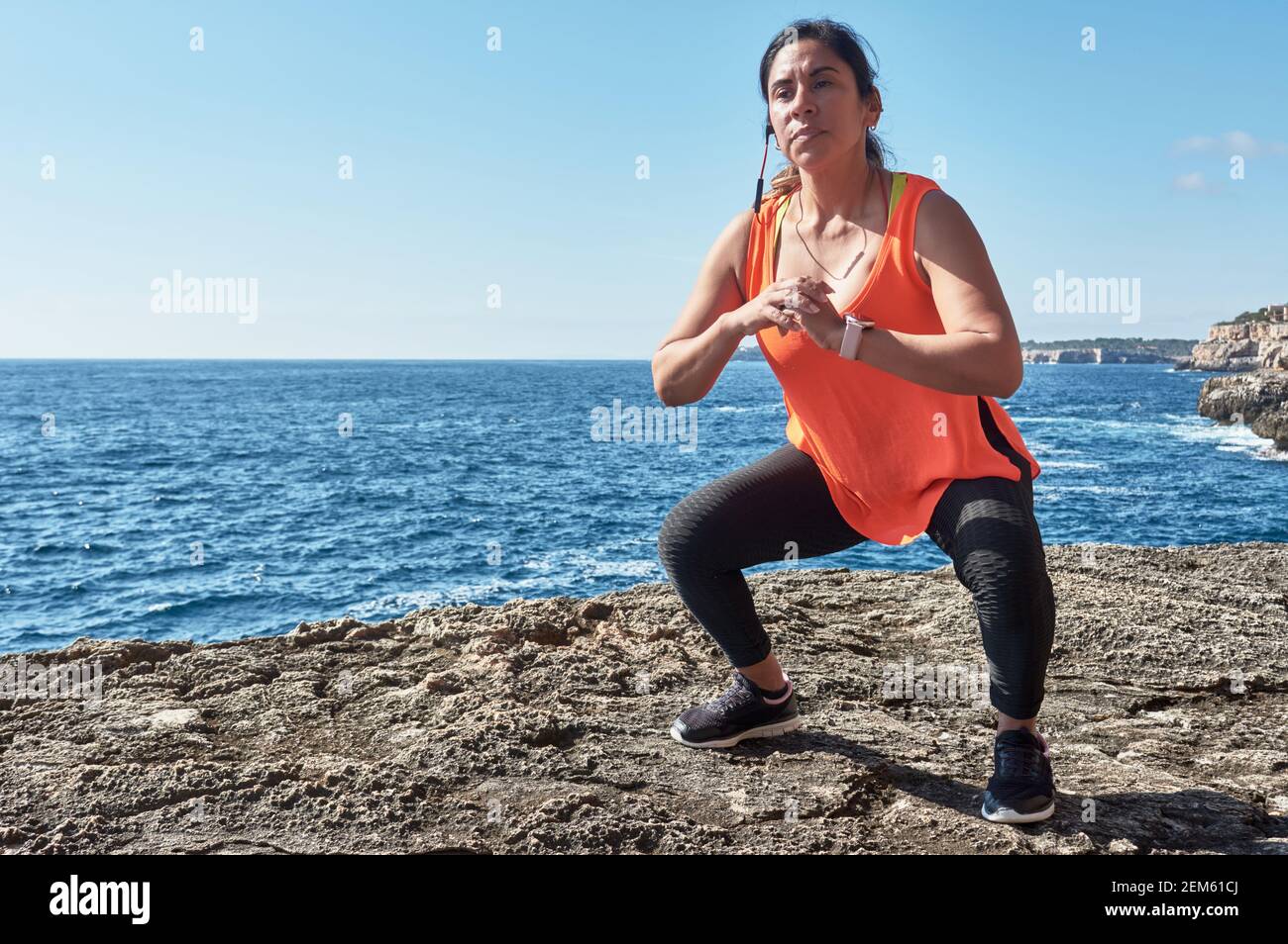 Woman squats exercise hi-res stock photography and images - Alamy