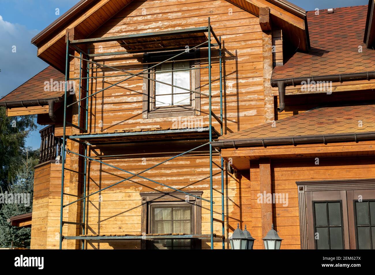 Modern wooden timber eco house villa facade during process of ...
