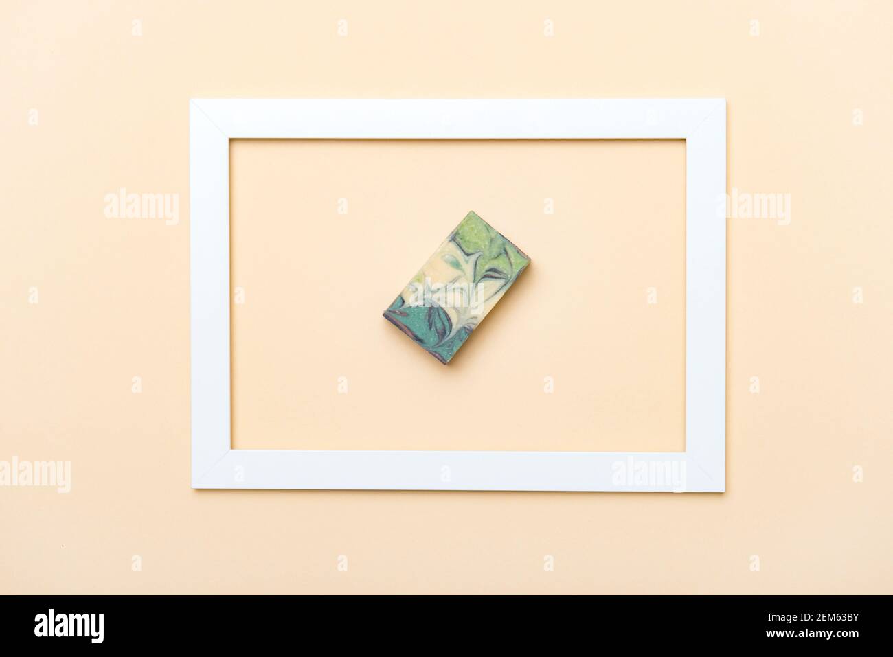 Handmade soap in the frame on a beige background. Eco lifestyle concept ...