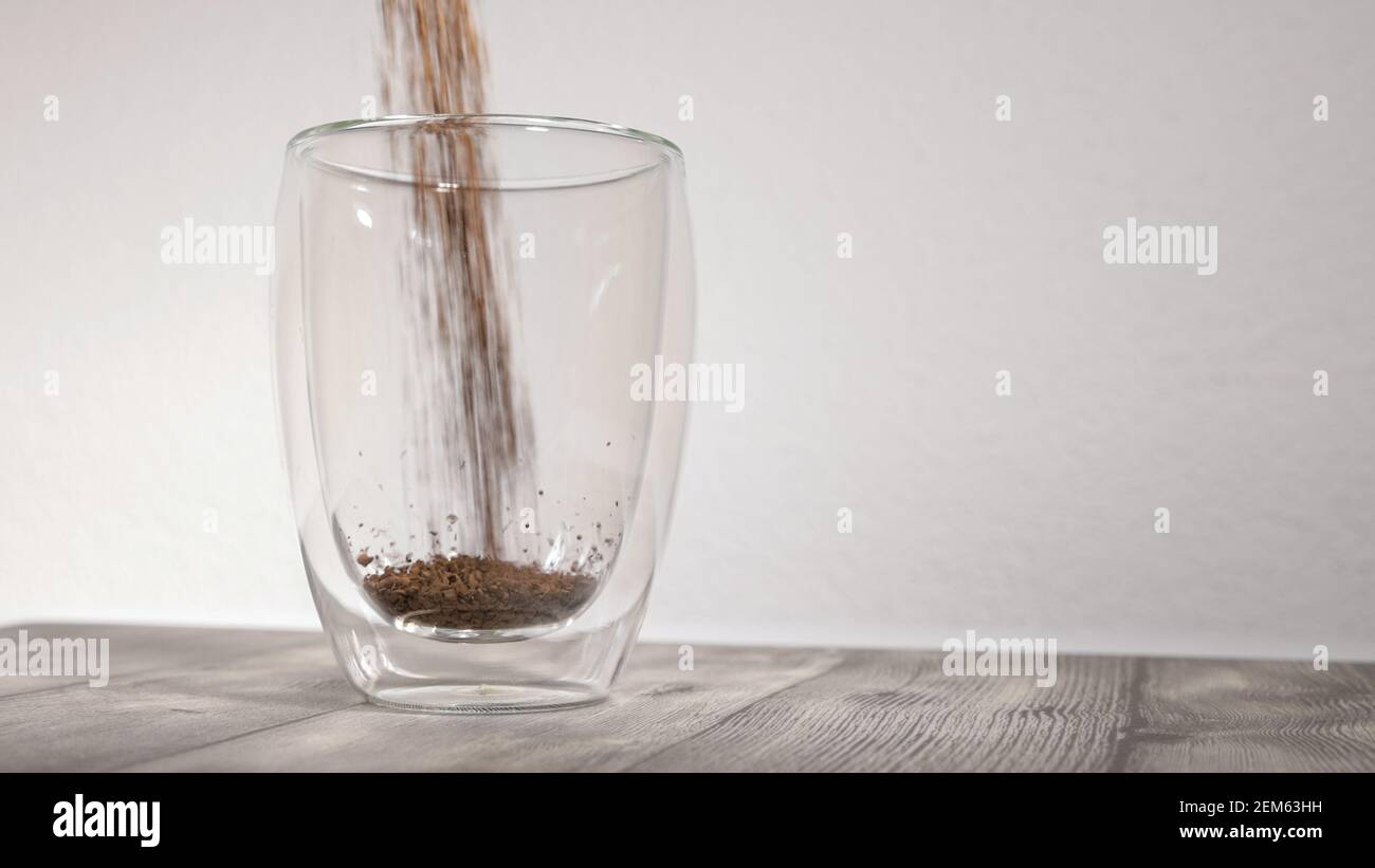 photo: empty thermo cup in front of white background: granular coffee ...