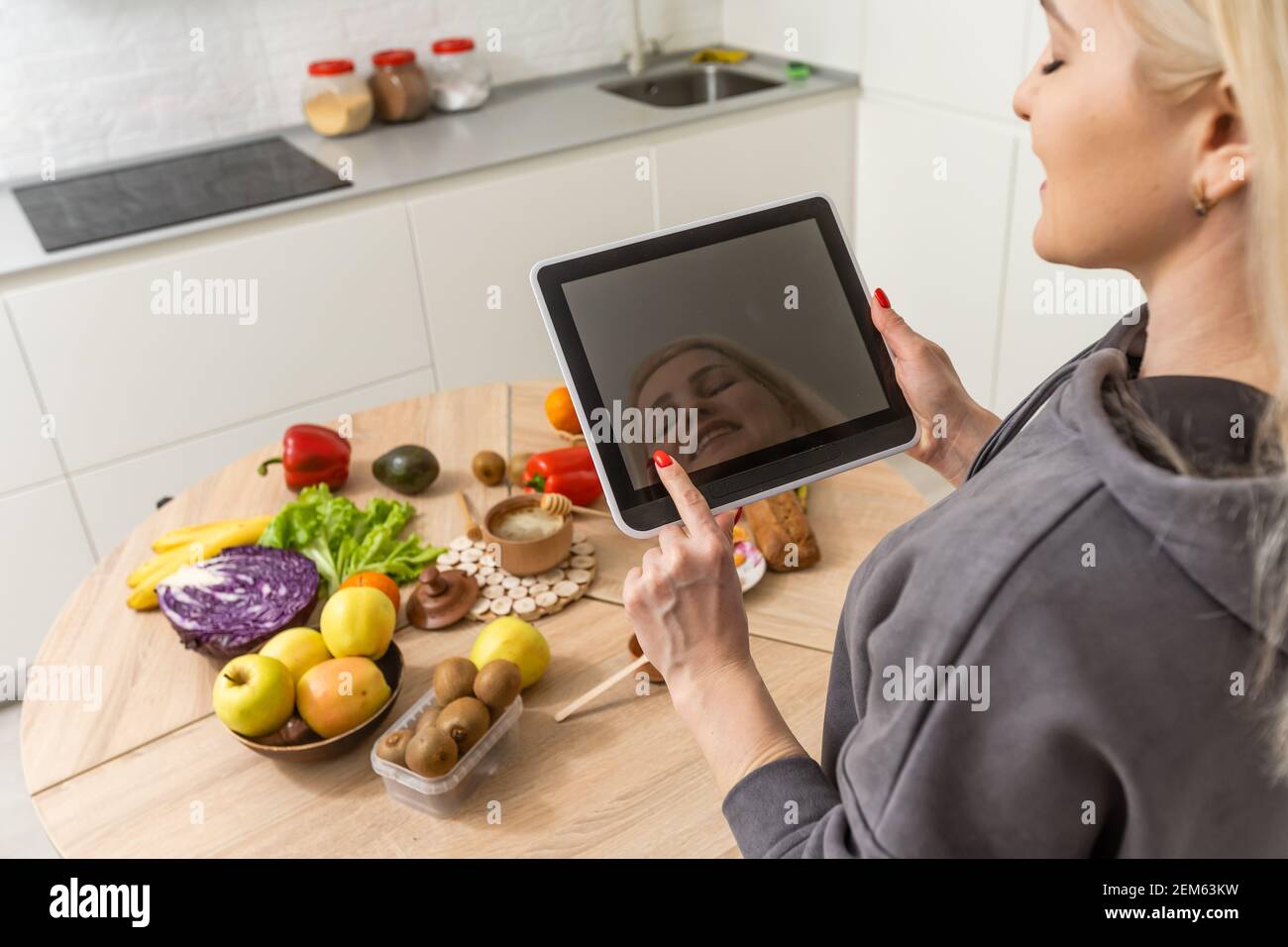 Healthy food. Woman preparing fruits and vegetables Stock Photo - Alamy