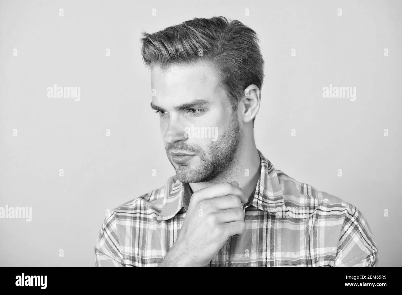 Handsome caucasian man with unshaven face skin and stylish hair yellow ...