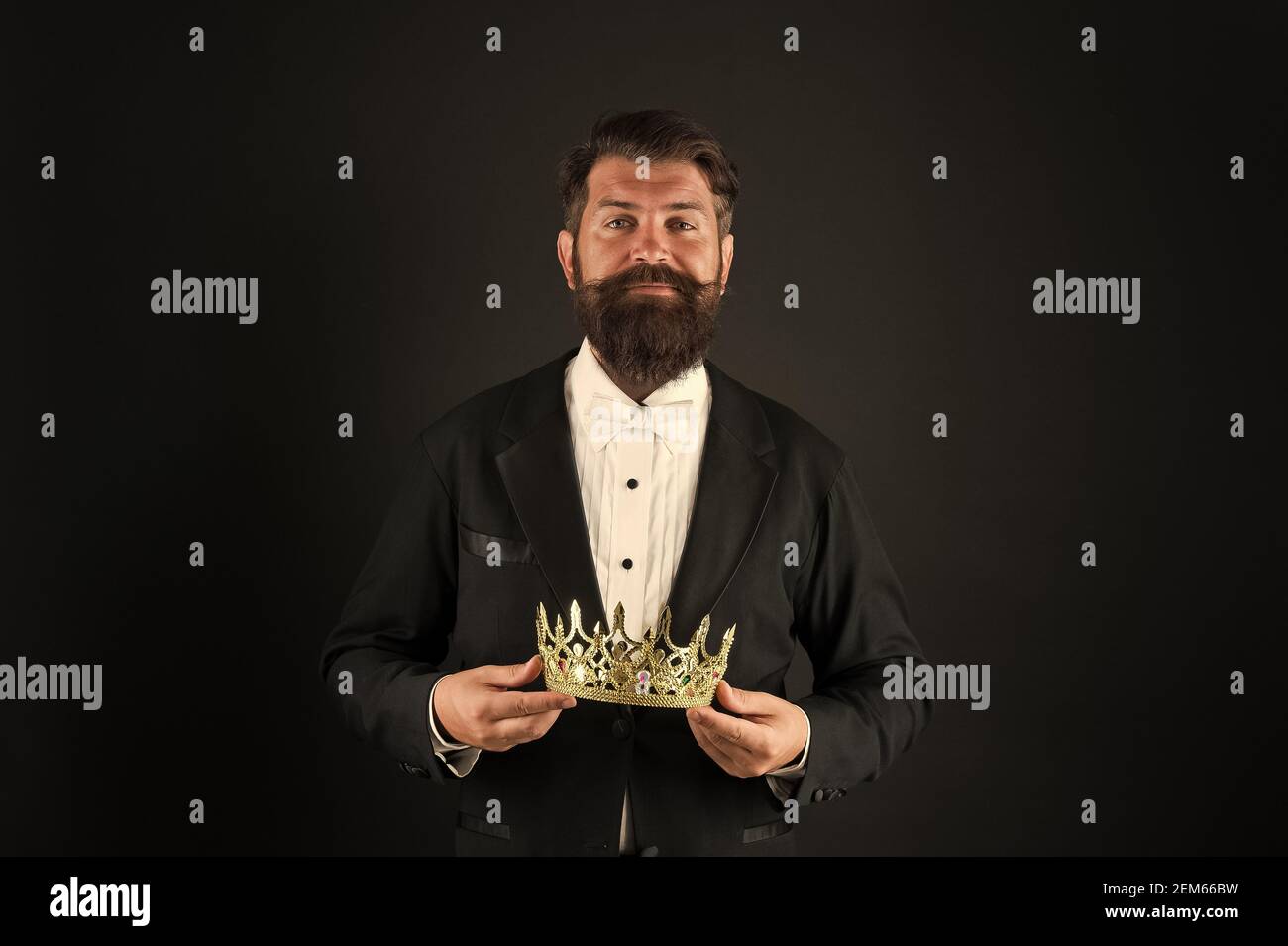 Now come and make it worth. Crown in hands. Handsome man give crown ...