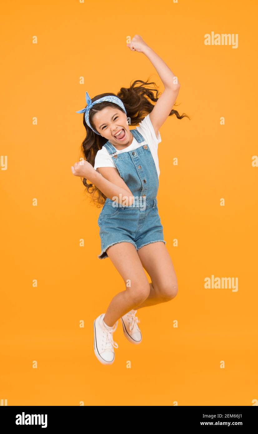 Energy inside. Feeling free. Carefree kid. Summer holidays. Jump of ...