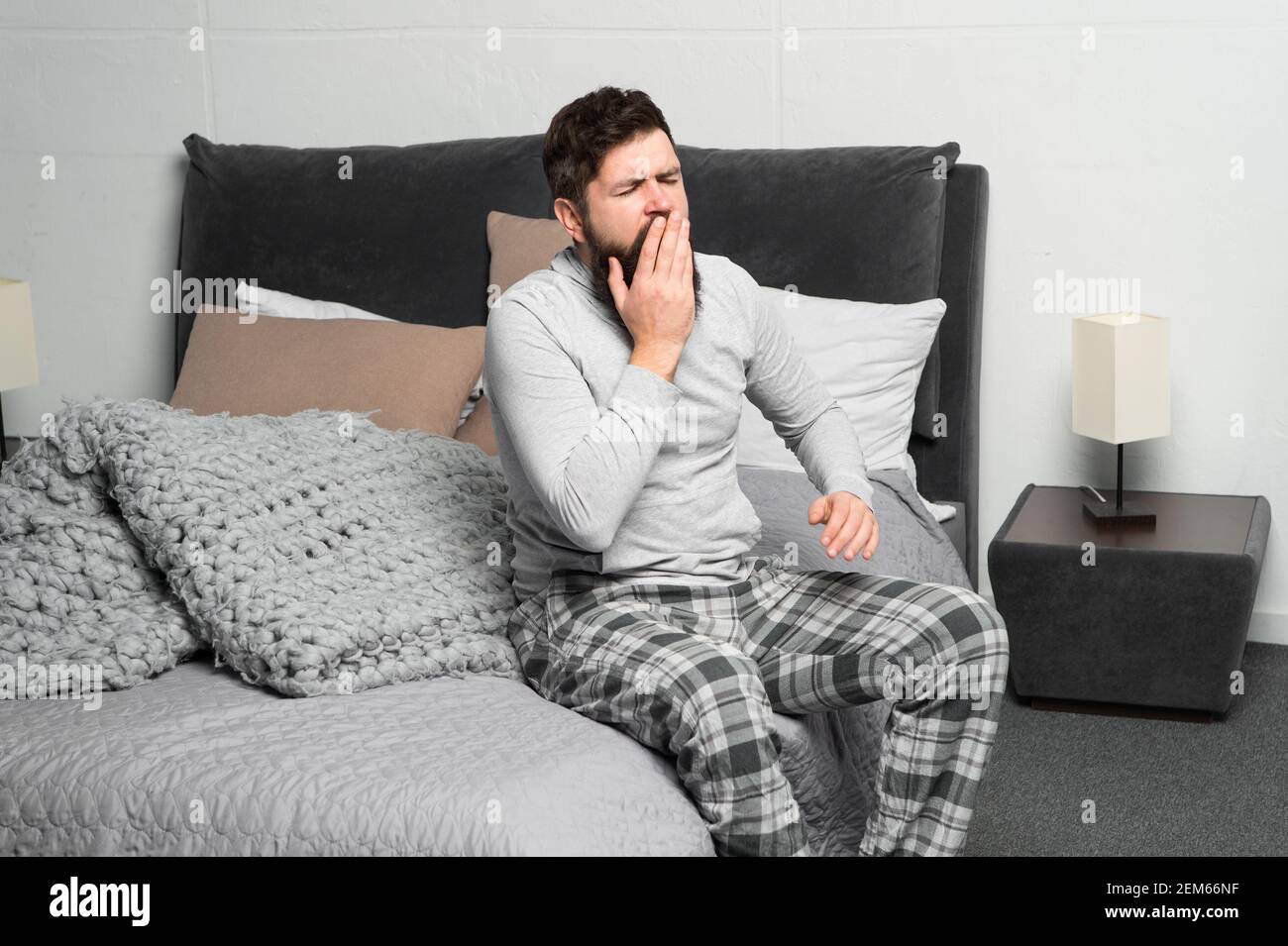 Get up early. Tips for waking up early. Man bearded hipster sleepy face ...