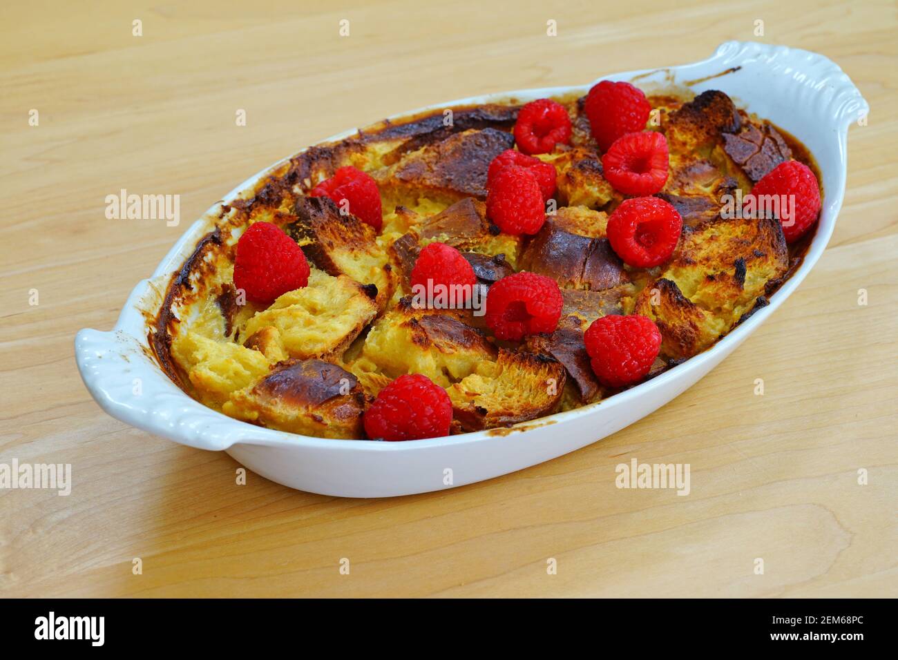 Dish of challah bread pudding with fresh raspberries Stock Photo - Alamy