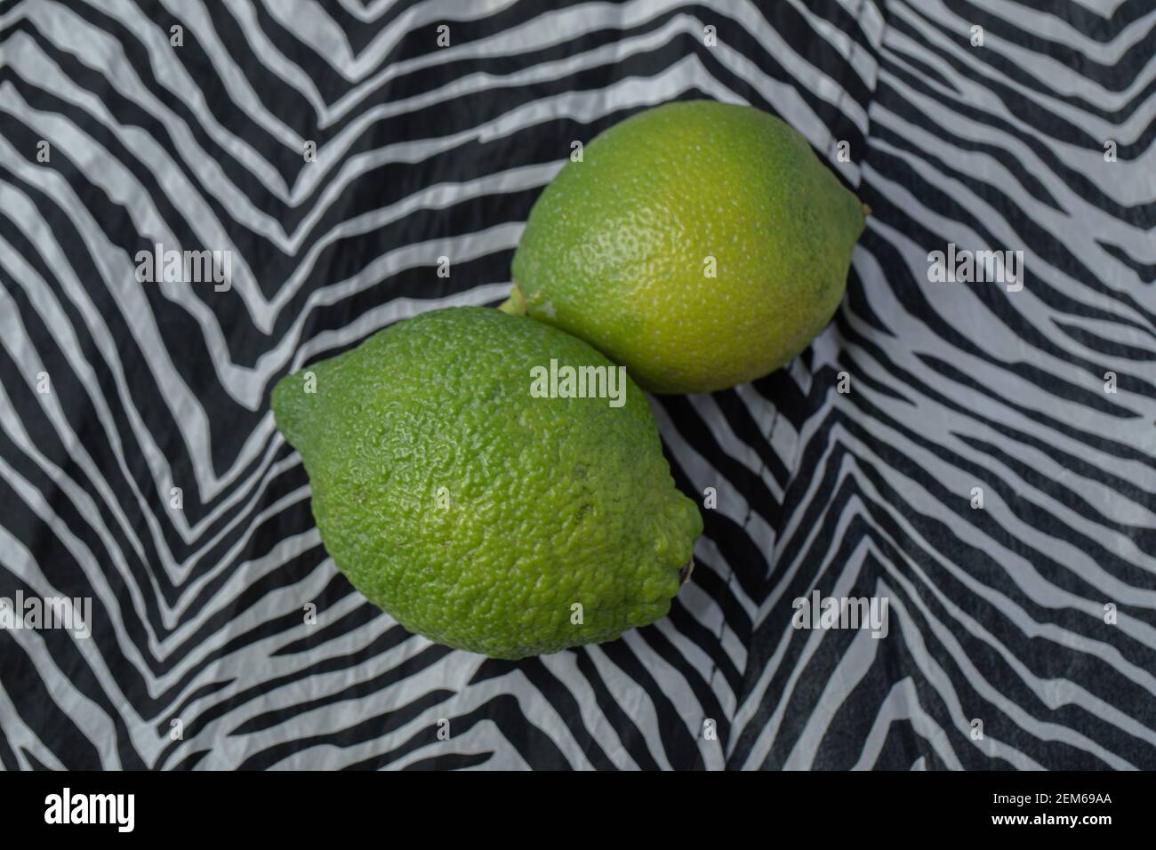 Two fresh green lemons hi-res stock photography and images - Alamy