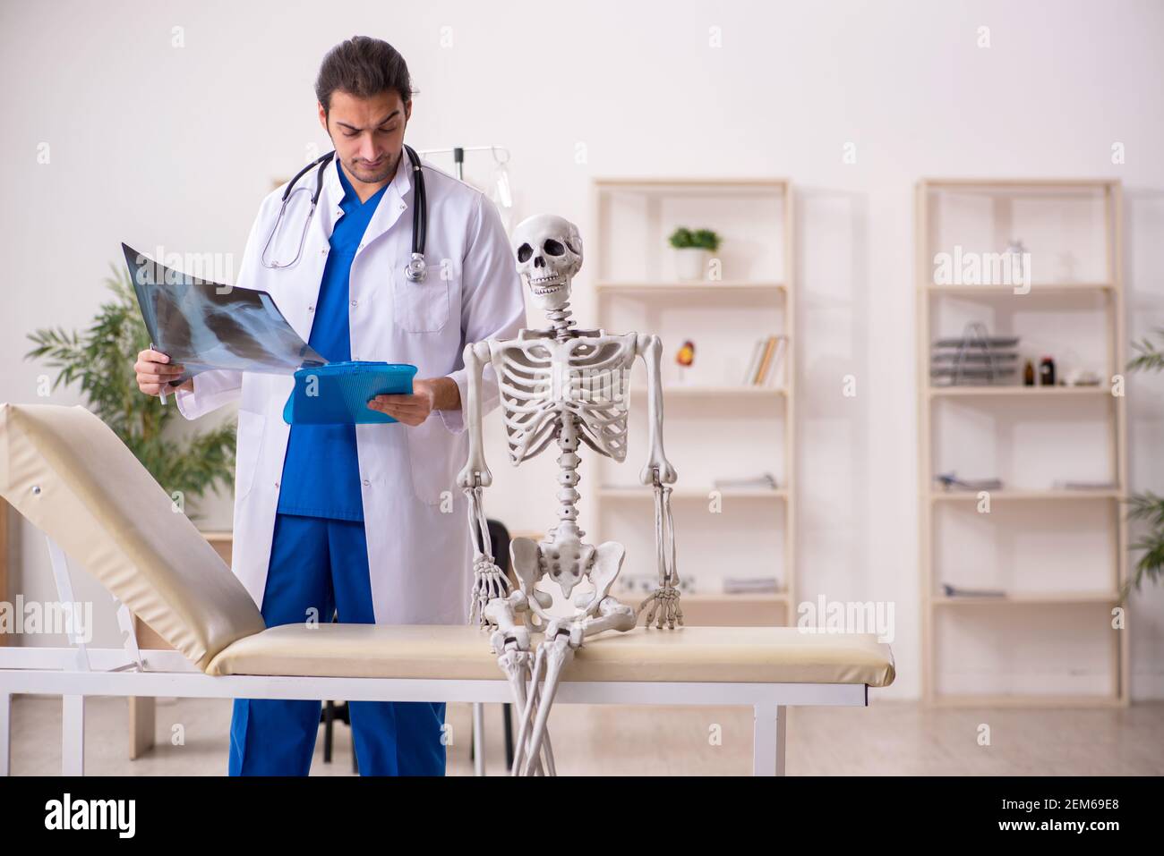 Young doctor radiologist and skeleton patient in the clinic Stock Photo ...