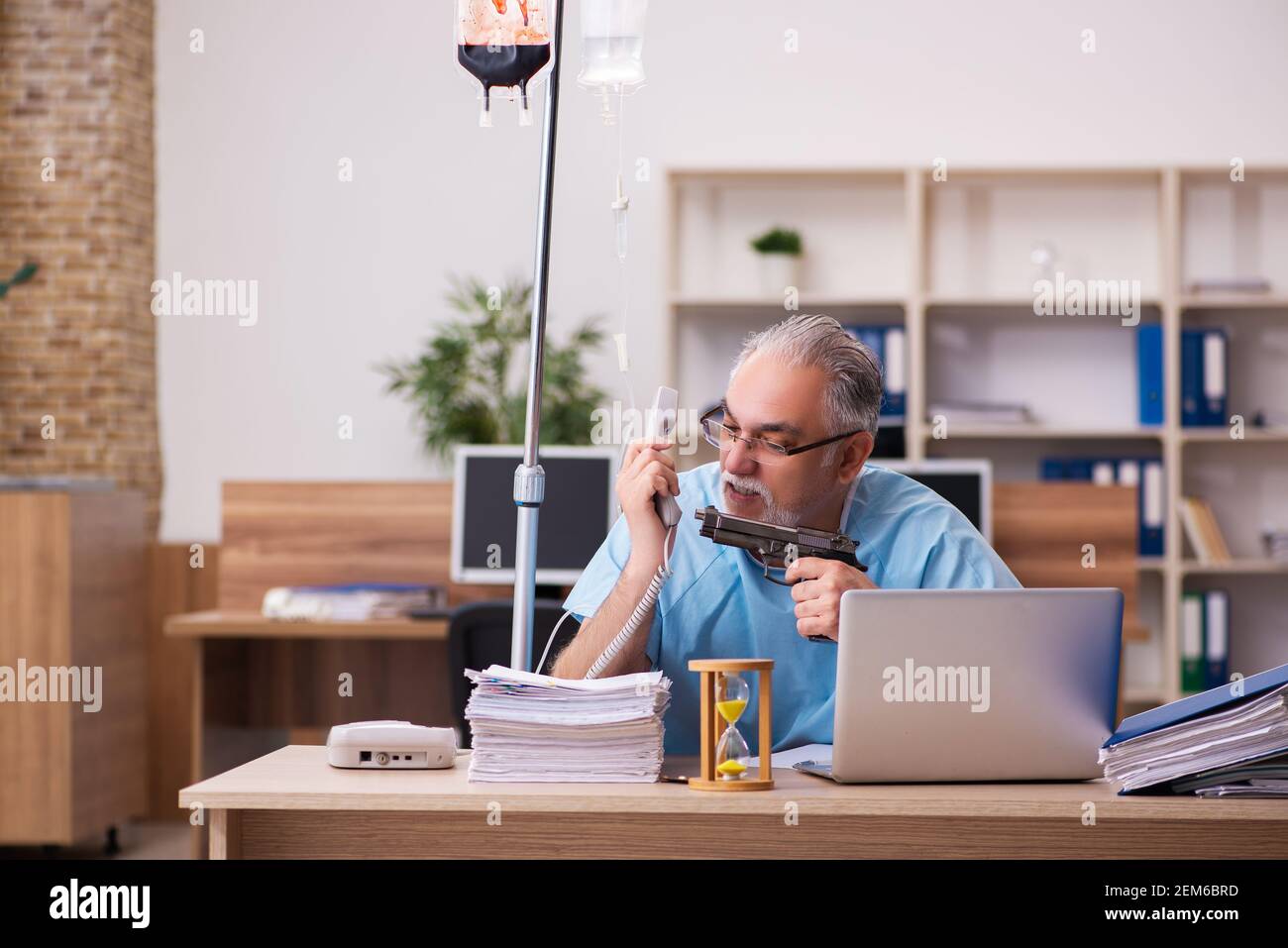 Old businessman employee in blood transfusion concept Stock Photo - Alamy