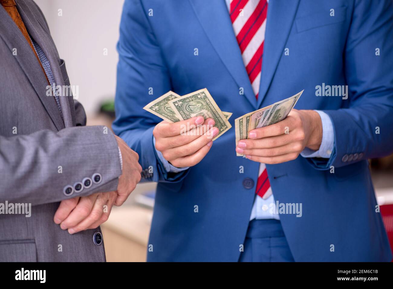 Giving salary to employees hi-res stock photography and images - Alamy