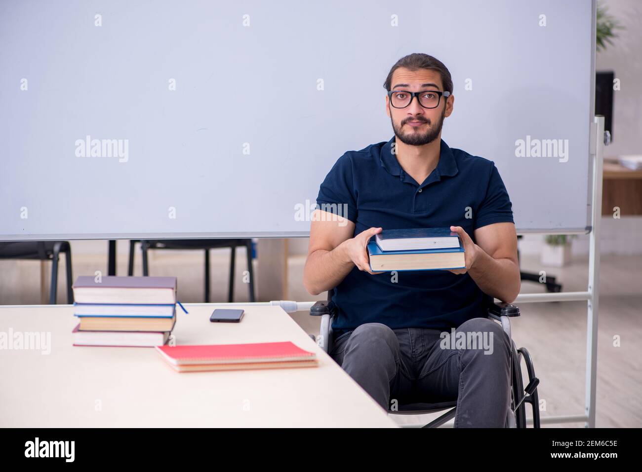 Young handicapped student in the classroom Stock Photo - Alamy