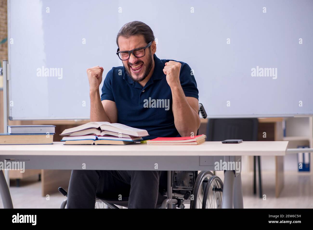 Young handicapped student in the classroom Stock Photo - Alamy