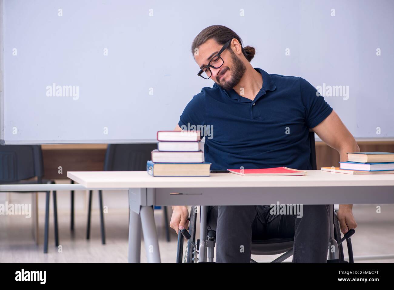 Young handicapped student in the classroom Stock Photo - Alamy
