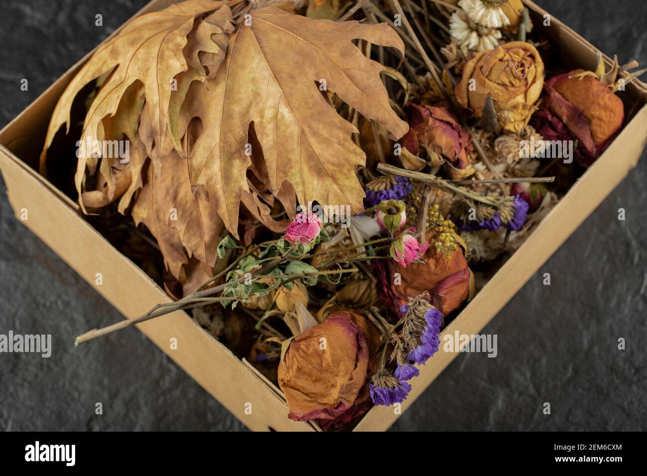 Dried roses flowers with dried leaves in a paper box Stock Photo - Alamy