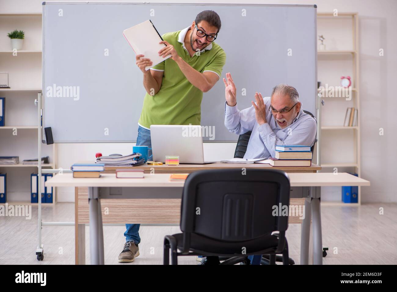 Angry teacher hitting student hi-res stock photography and images - Alamy