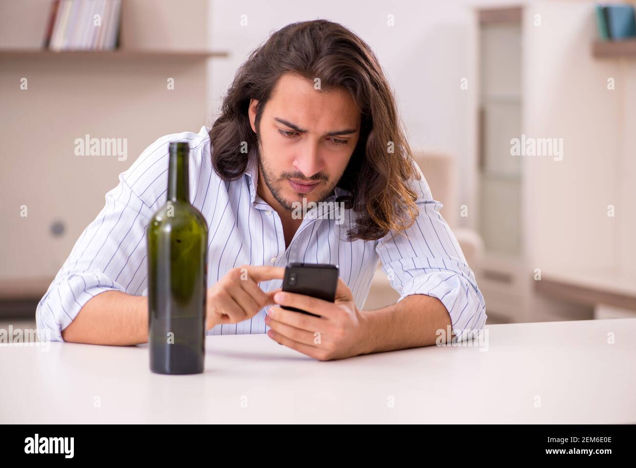 Man drinking alcohol at home Stock Photo - Alamy