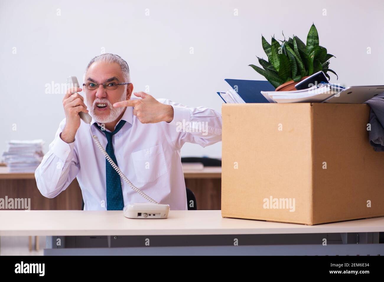Old employee being fired from his work Stock Photo - Alamy
