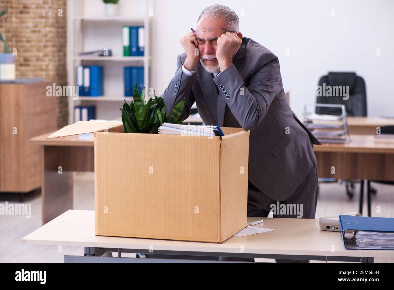 Old employee being fired from his work Stock Photo - Alamy