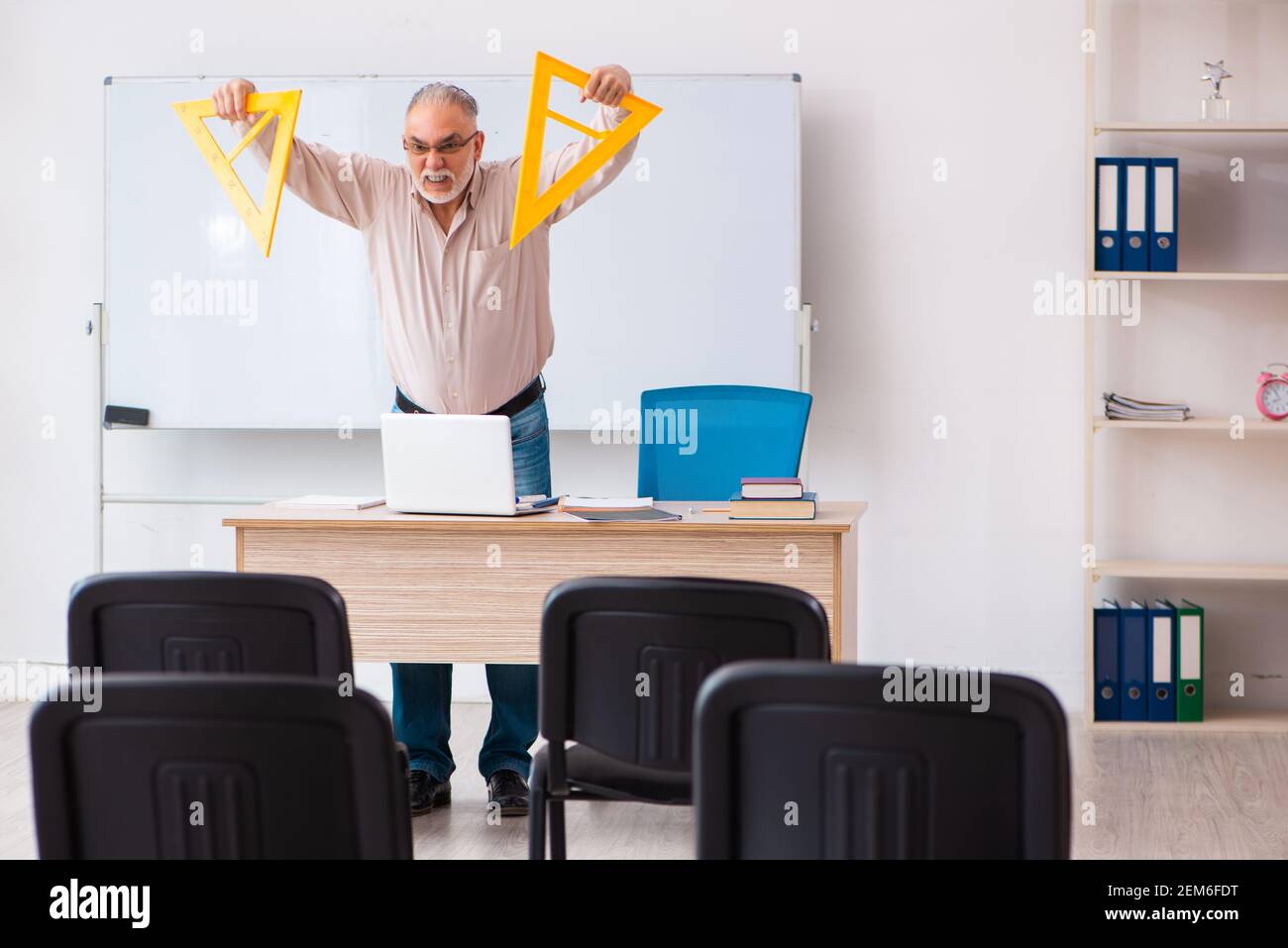 Angry teacher and ruler hi-res stock photography and images - Alamy