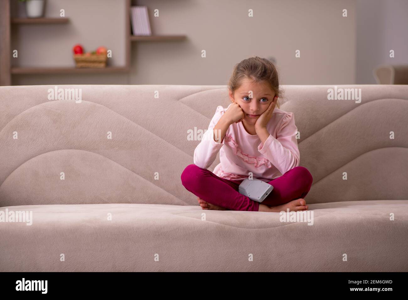 Little girl staying alone at home Stock Photo - Alamy