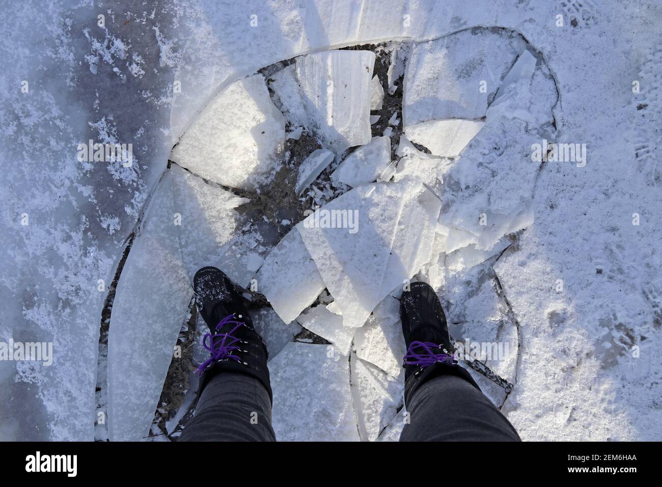 Dangerous thin ice. A woman broke into the ice in winter Stock Photo ...