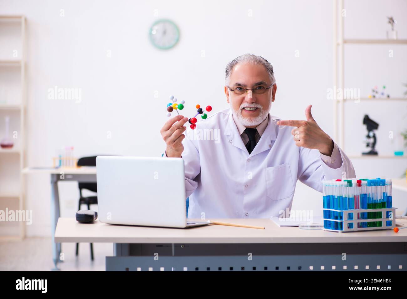 Senior male scientist studying molecular model Stock Photo - Alamy