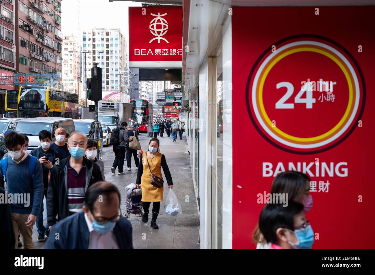 Hong Kong, China. 24th Feb, 2021. Pedestrians walk past the Bank of ...