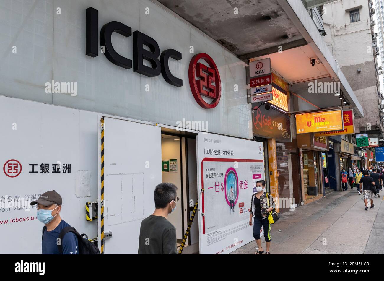 Hong Kong, China. 24th Feb, 2021. Pedestrians walk past the Chinese ...