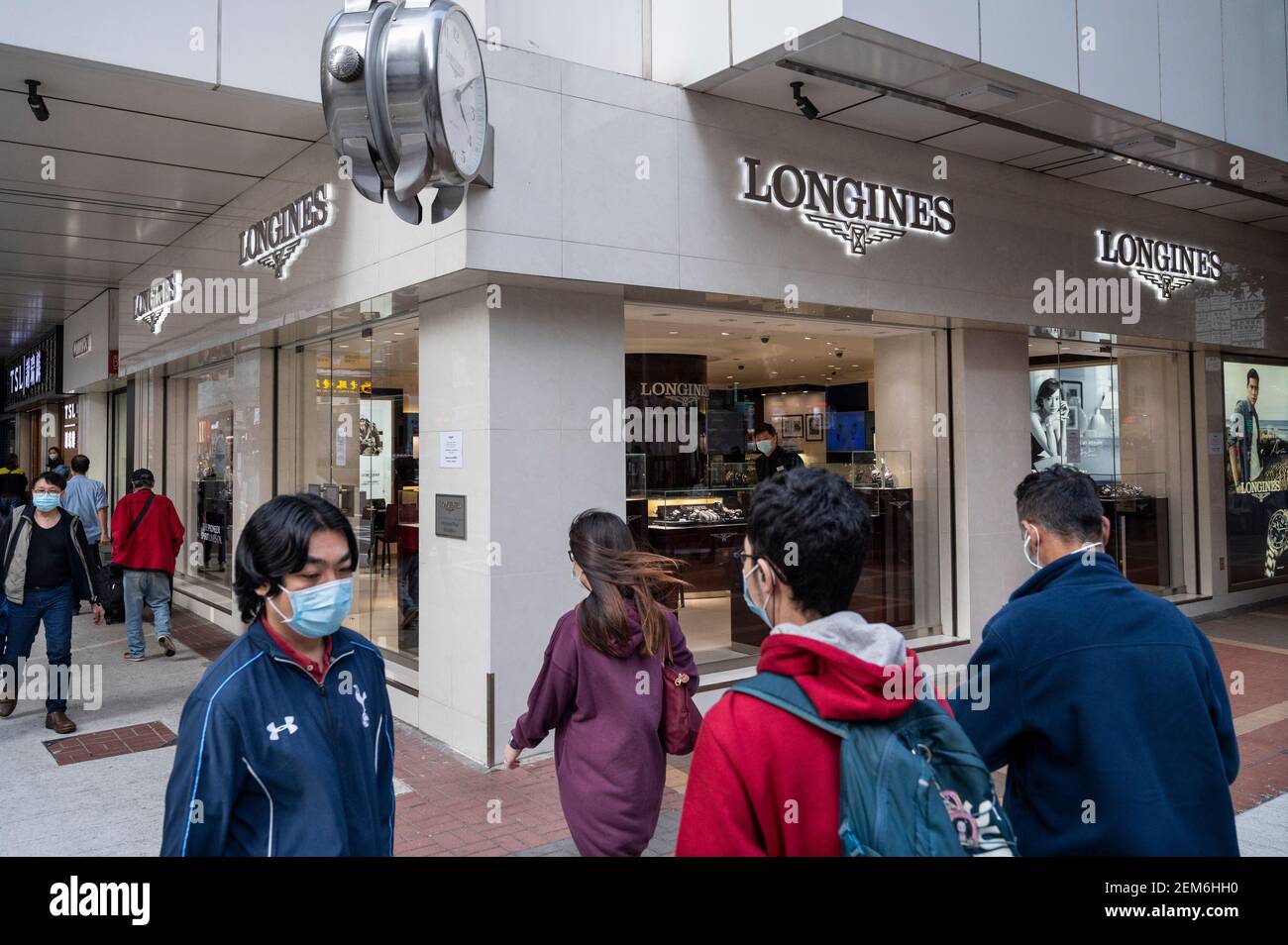 Hong Kong, China. 24th Feb, 2021. Pedestrians walk past the Swiss ...