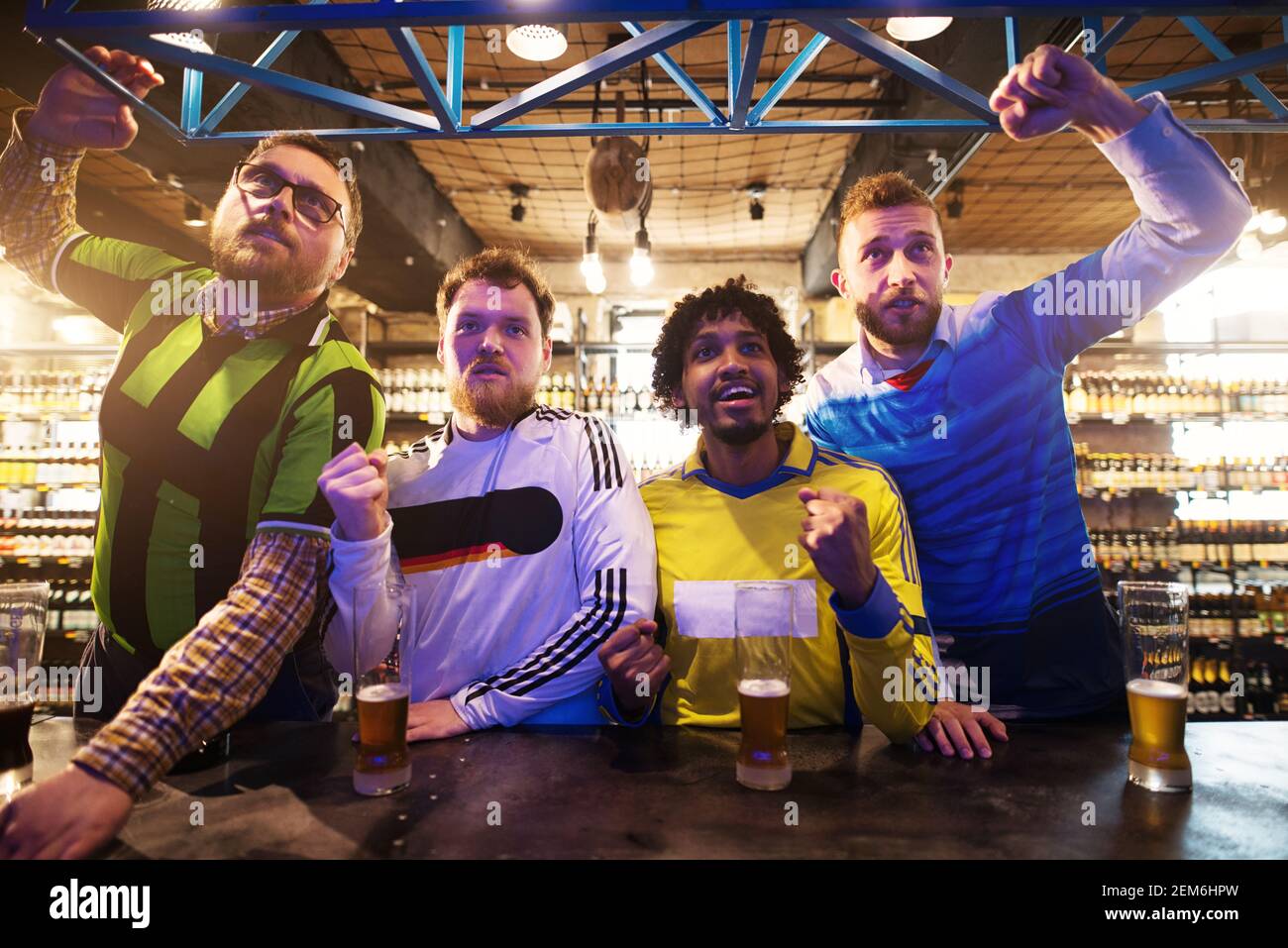 Soccer fans are celebrating the goal their team has scored while ...