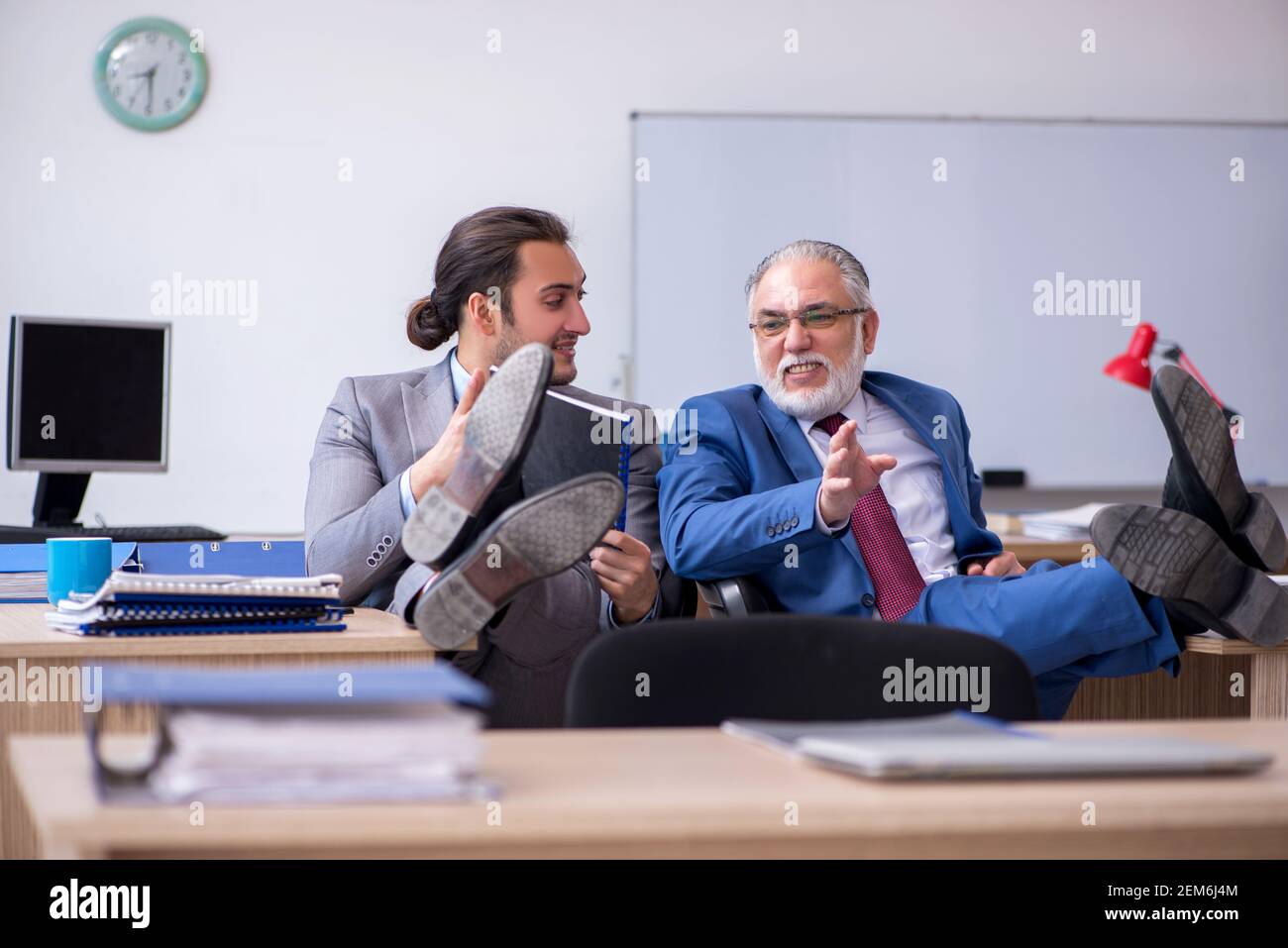Two employees working in the office Stock Photo - Alamy