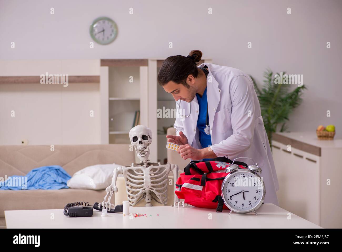 Male paramedic visiting skeleton patient Stock Photo - Alamy