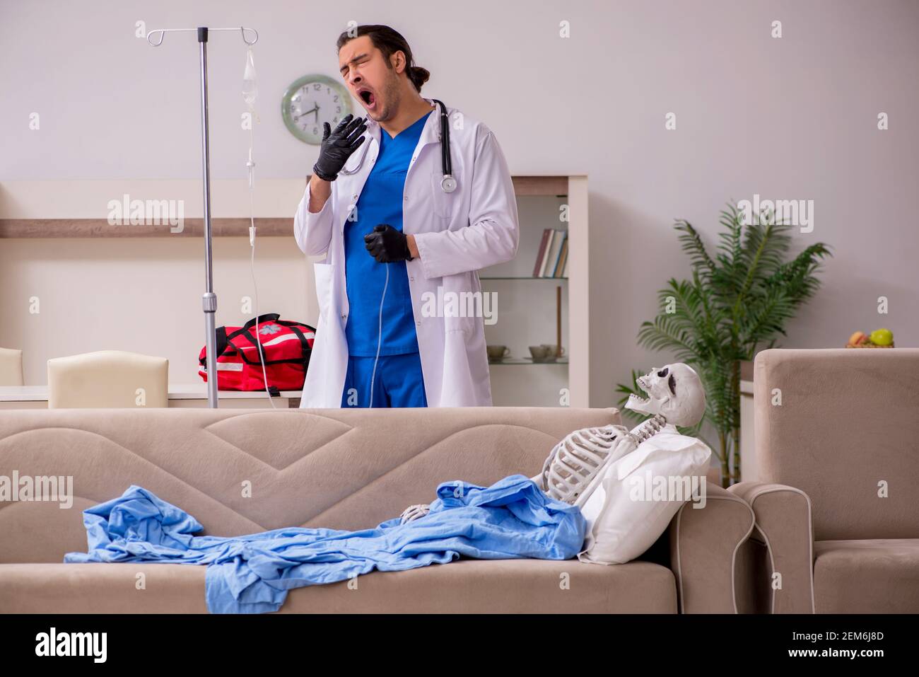 Male paramedic visiting skeleton patient Stock Photo - Alamy
