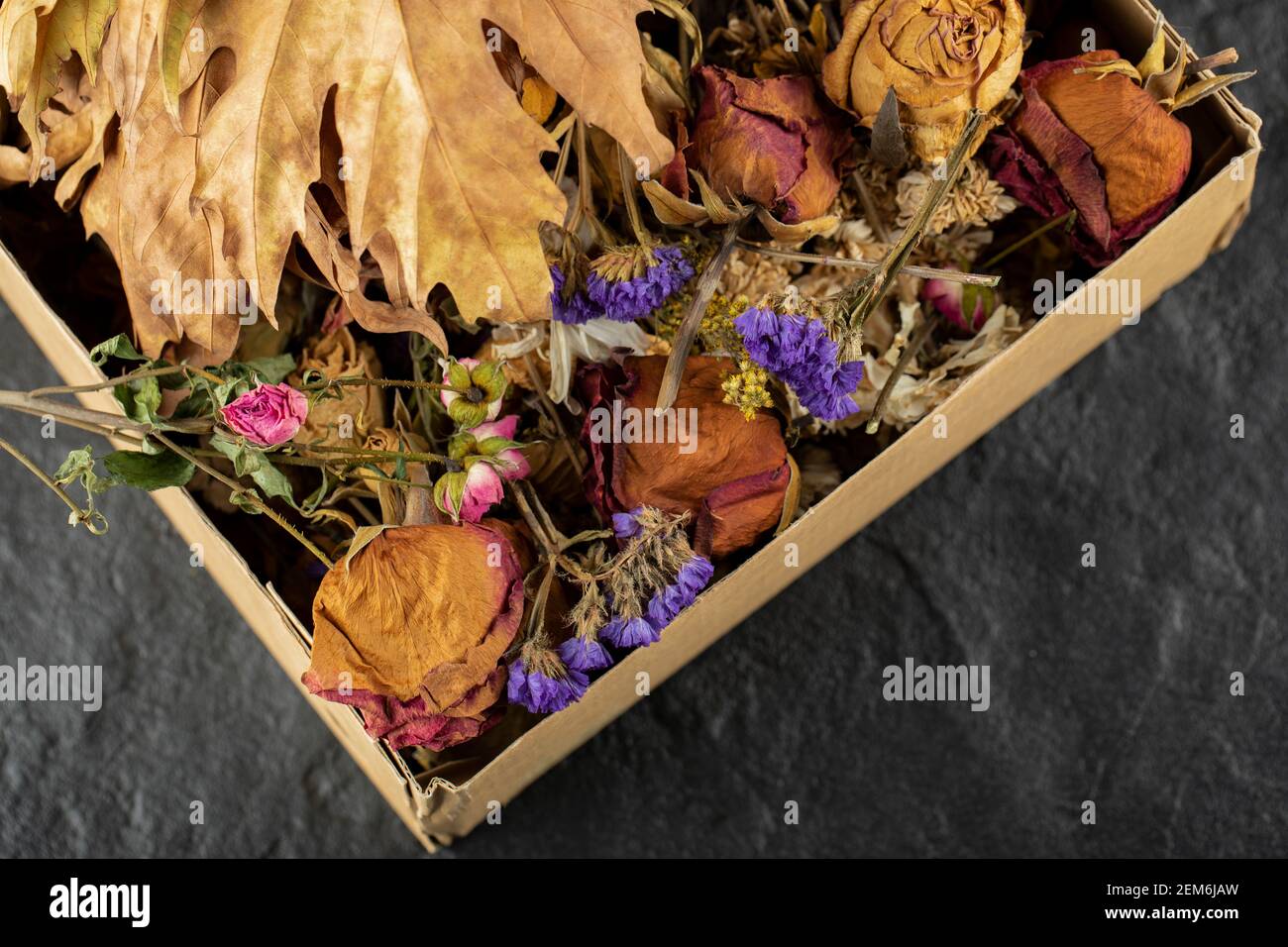 Dried roses flowers with dried leaves in a paper box Stock Photo - Alamy
