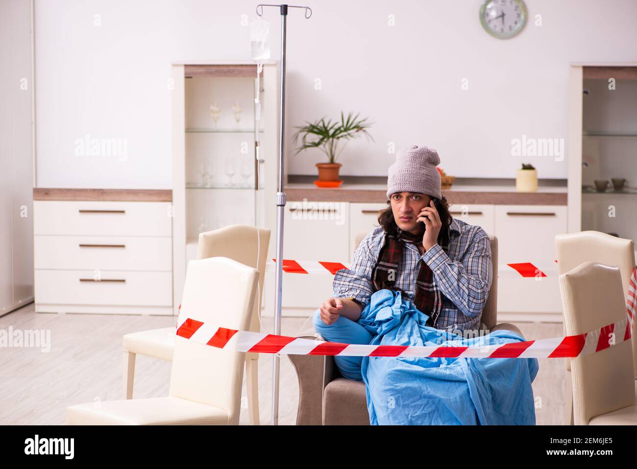 Sick man suffering at home in pandemic concept Stock Photo - Alamy