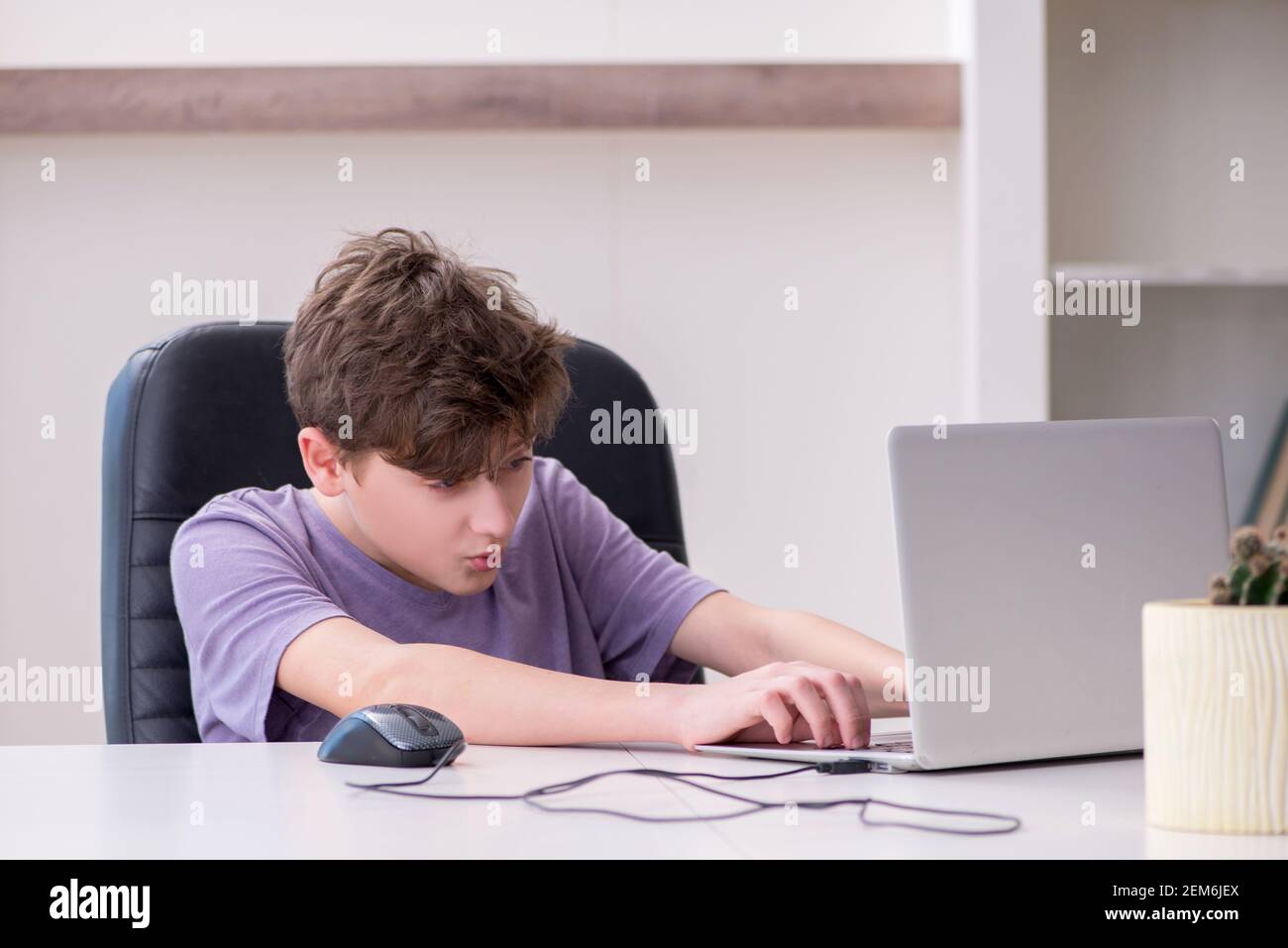 Boy playing computer games at home Stock Photo - Alamy