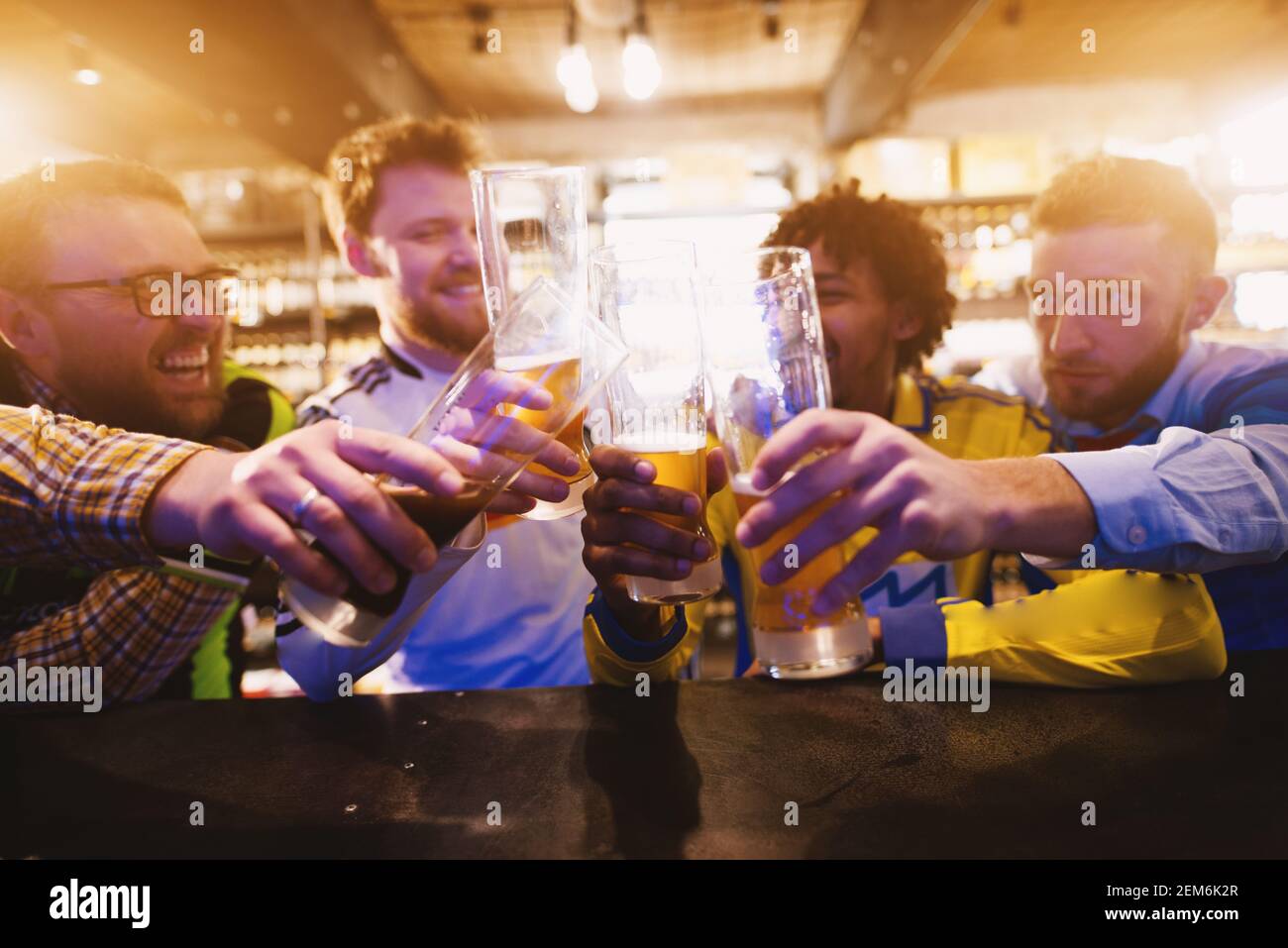 Football fans are saluting with beer pints after the game Stock Photo ...