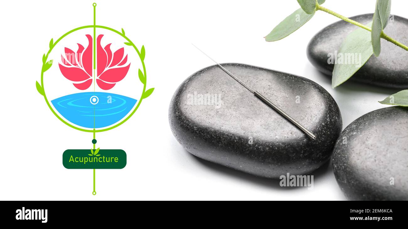 Acupuncture needles and spa stones on white background Stock Photo - Alamy
