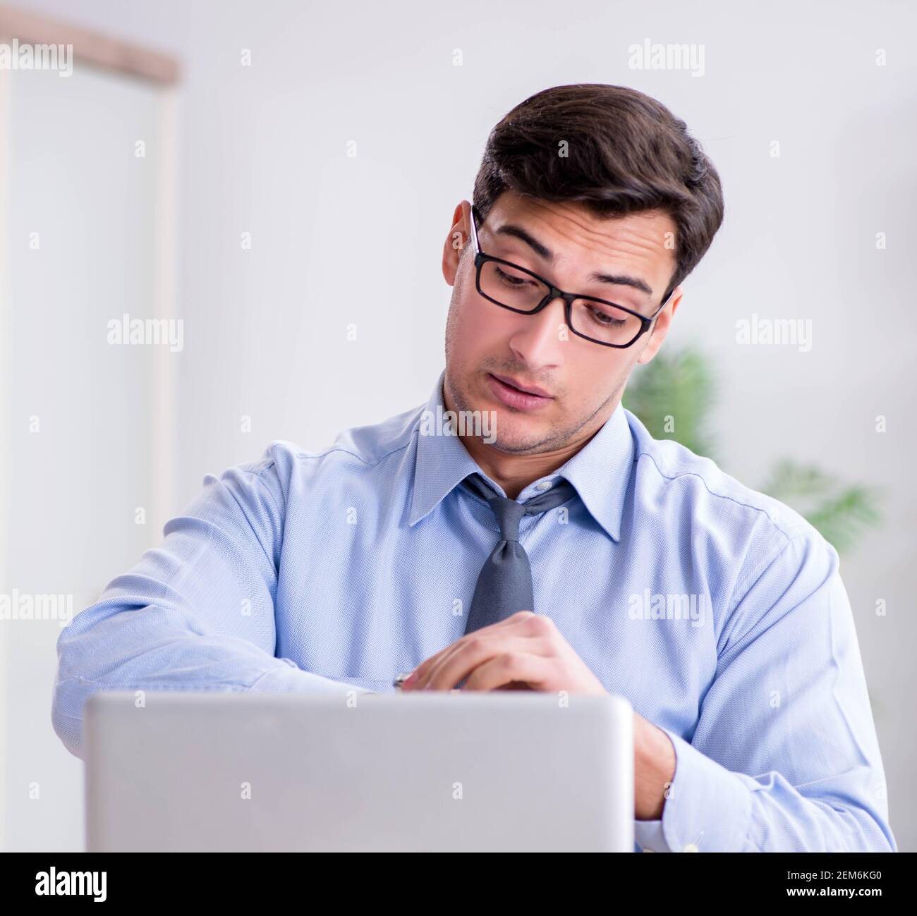 The extremely busy businessman working in office Stock Photo - Alamy