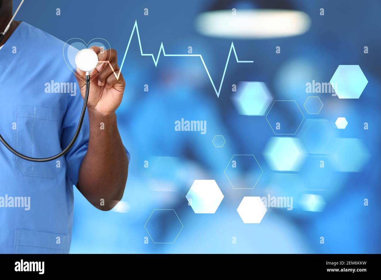 African-American cardiologist with stethoscope using virtual screen on ...