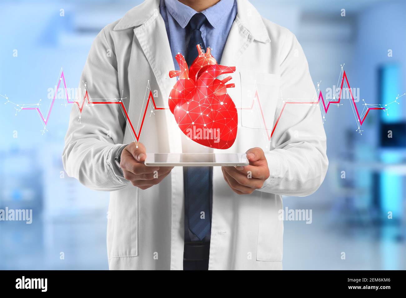 Cardiologist with tablet computer using virtual screen on color ...