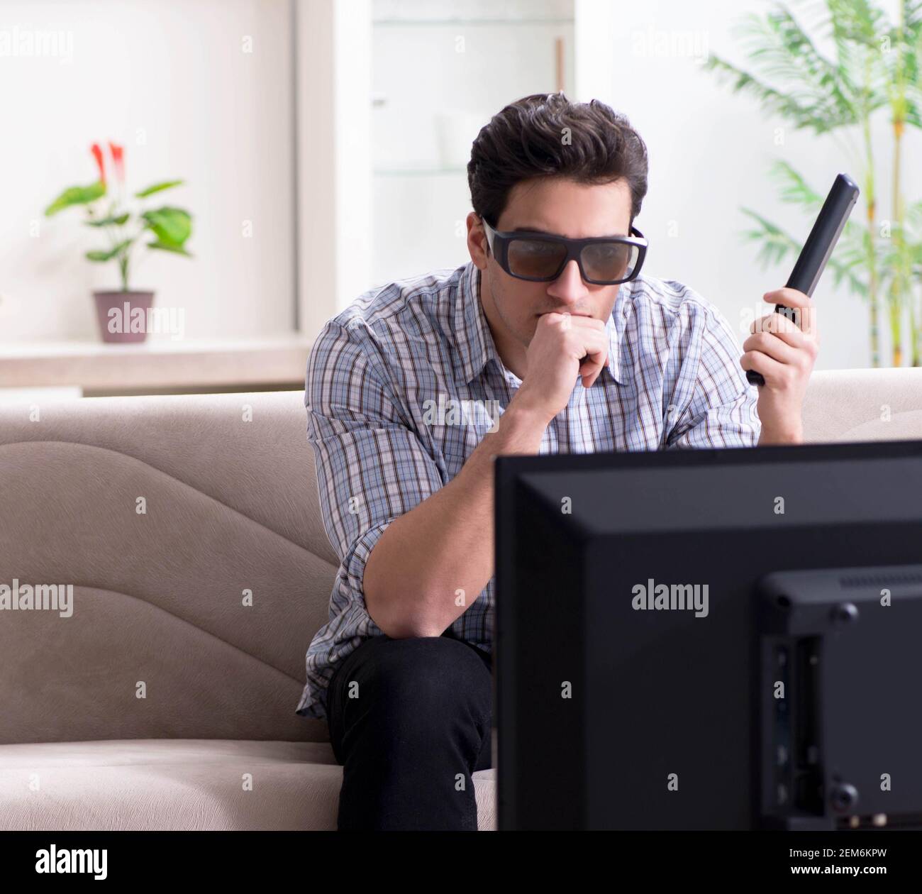 The man watching 3d tv at home Stock Photo - Alamy
