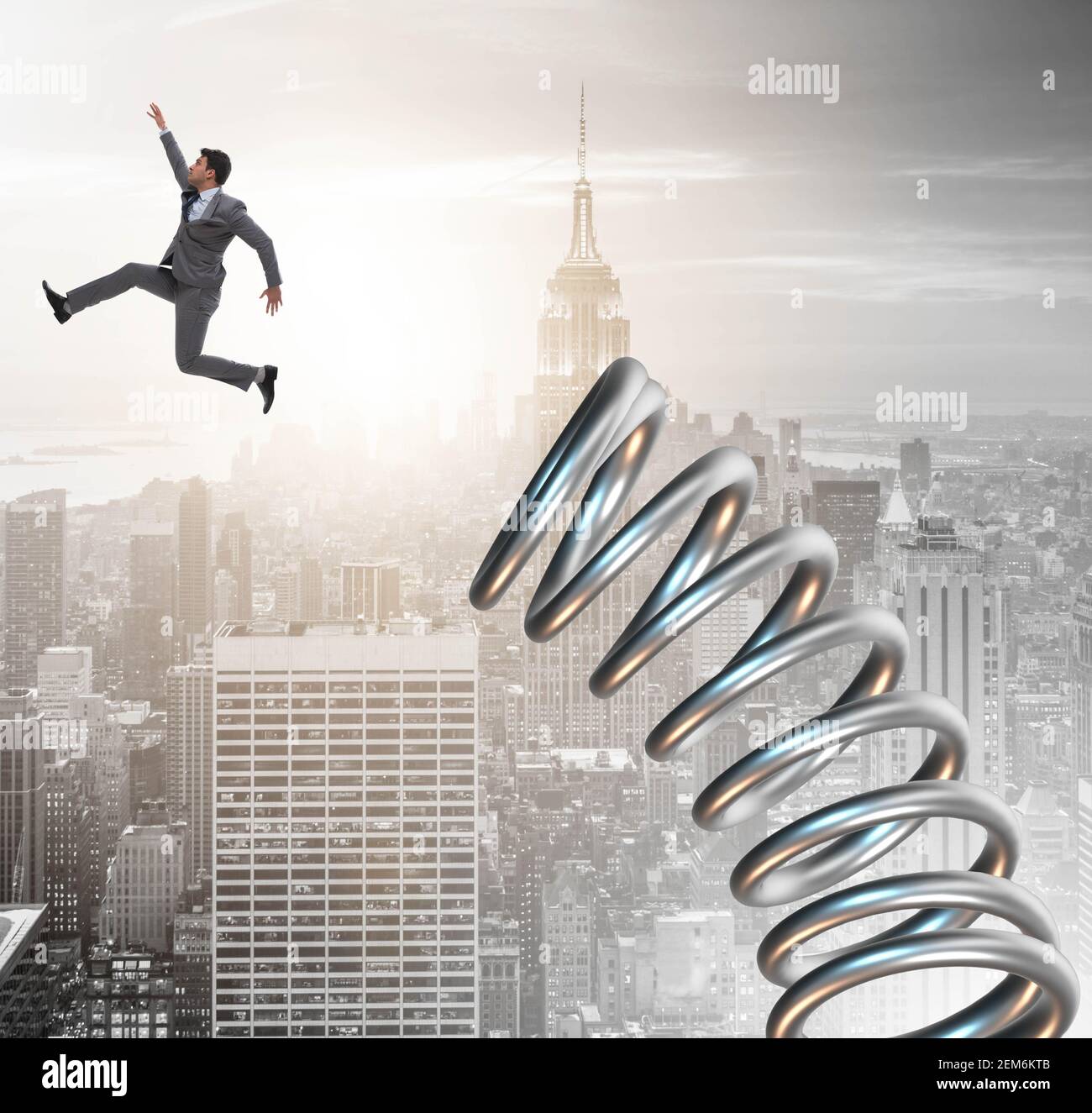 The businessman jumping from spring in promotion concept Stock Photo ...