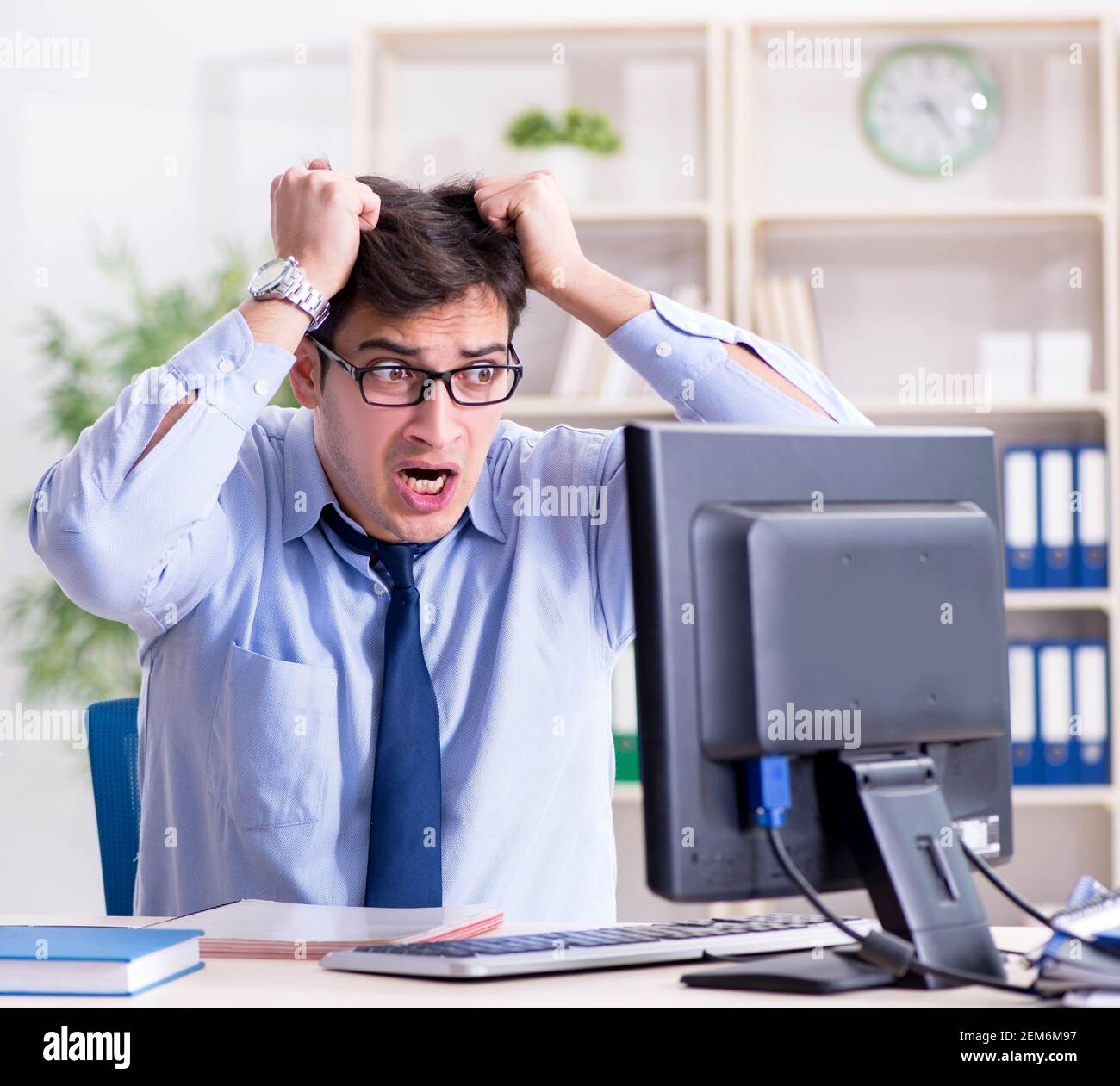 The angry businessman frustrated with too much work Stock Photo - Alamy